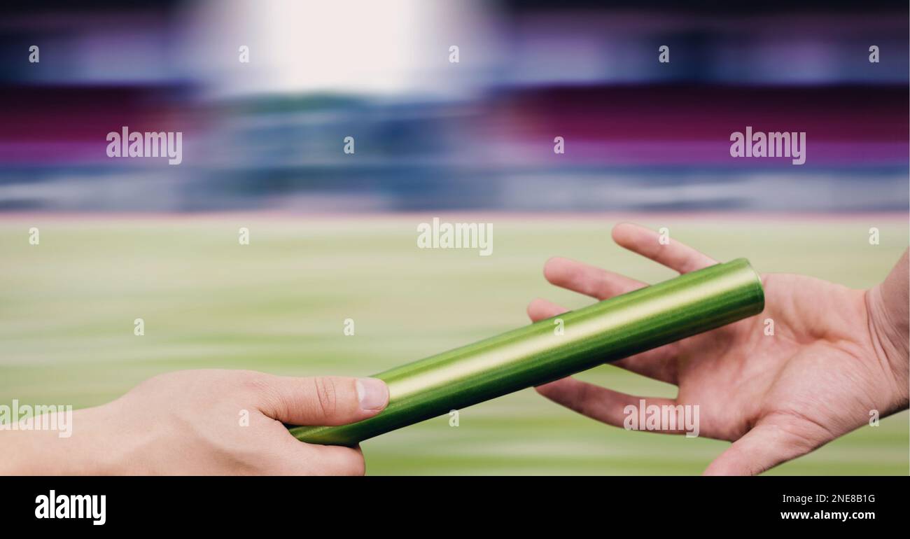 Composition of midsection of caucasian athletes passing green relay ...