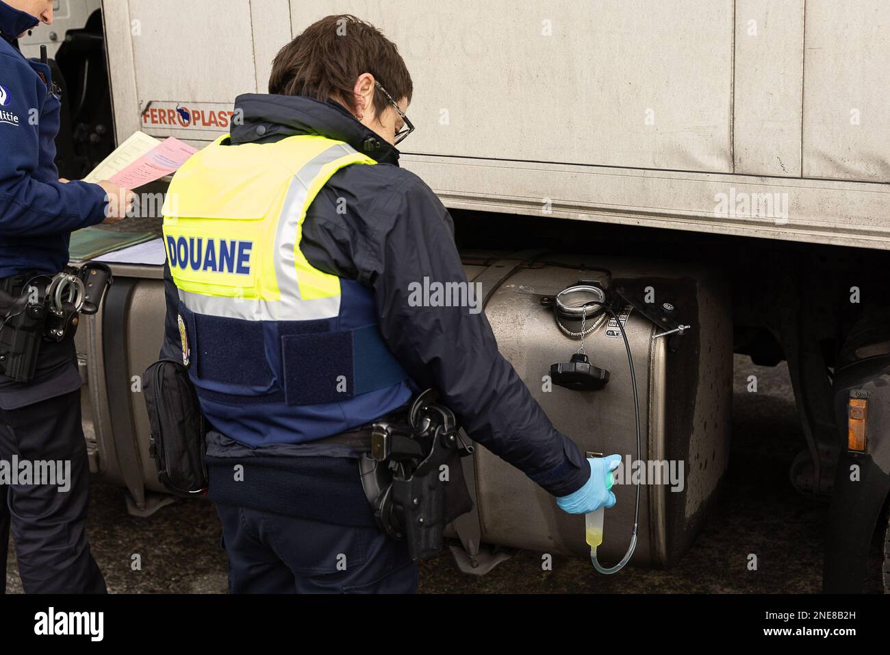 Illustration picture shows a customs officer performing fuel control of ...