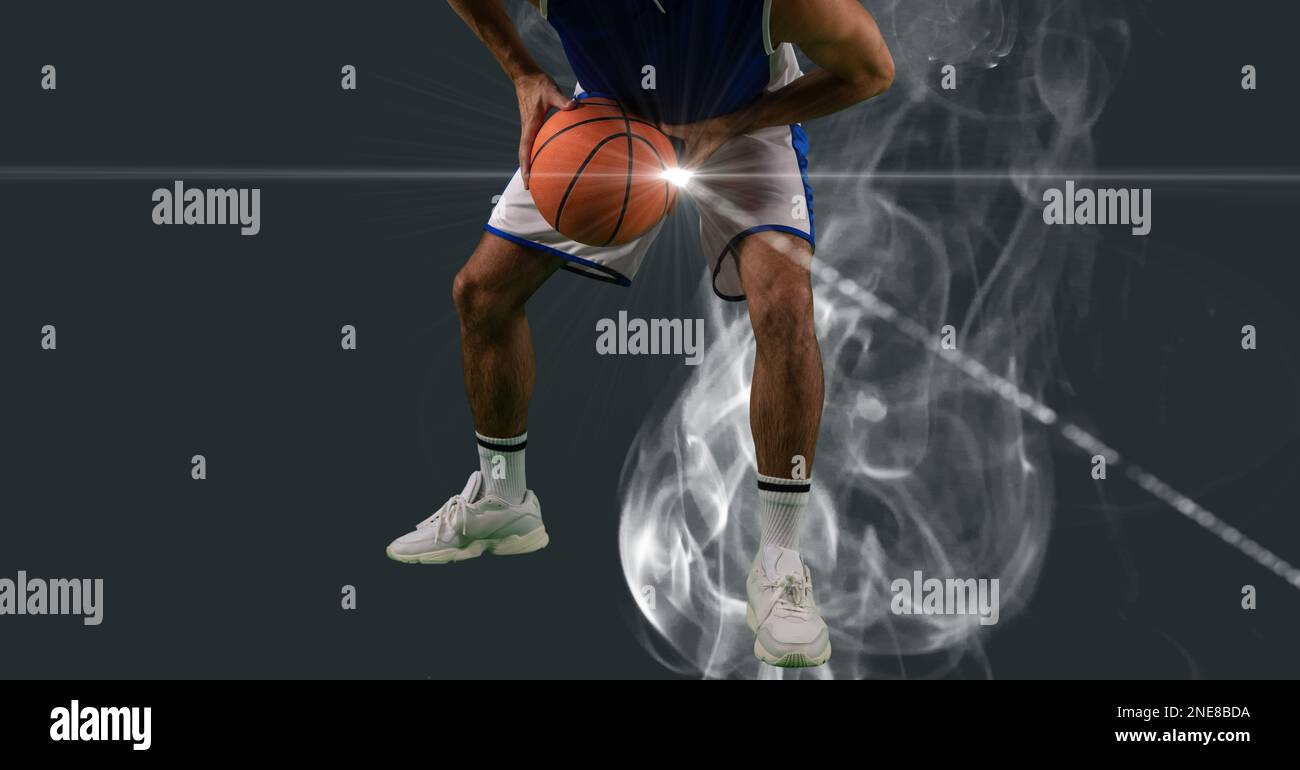 Composition of male basketball player holding basketball with copy ...