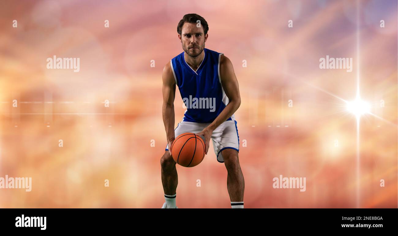 Composition of male basketball player holding basketball with copy ...
