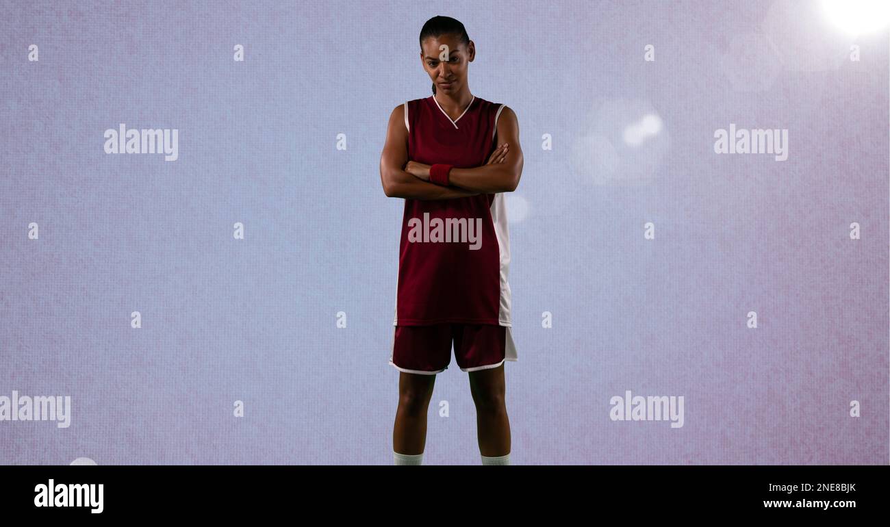 Composition of female basketball player with arms crossed with copy ...