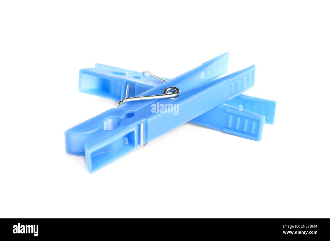 Light blue plastic clothespins on white background Stock Photo - Alamy