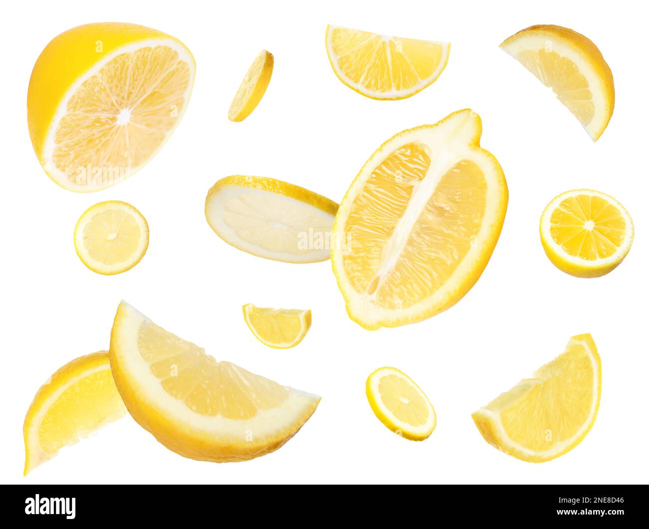 Fresh cut lemons flying on white background Stock Photo - Alamy