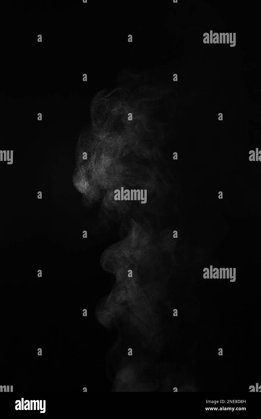 White steam column rising on black background Stock Photo - Alamy