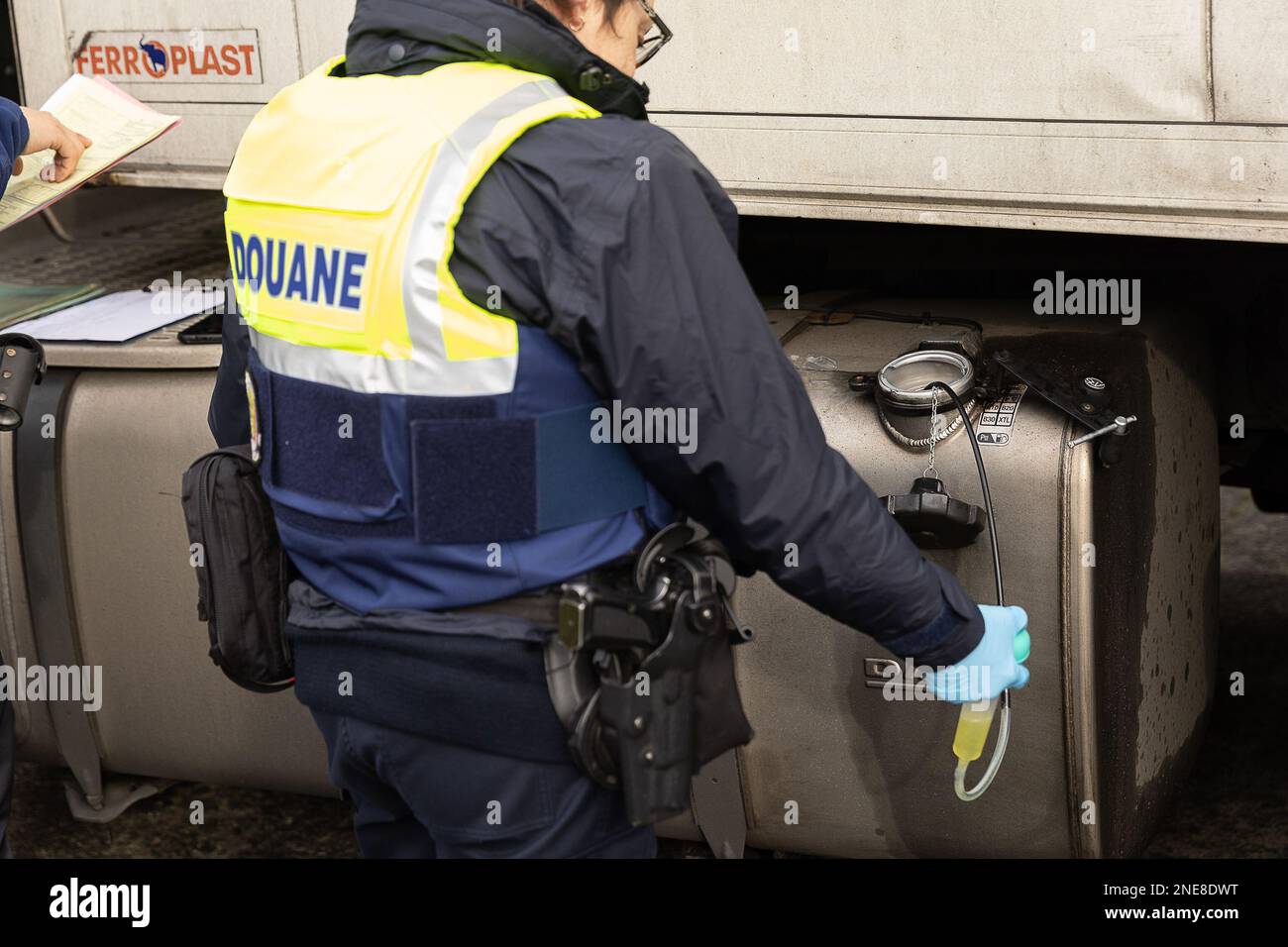 Illustration picture shows a customs officer controlling fuel of a ...