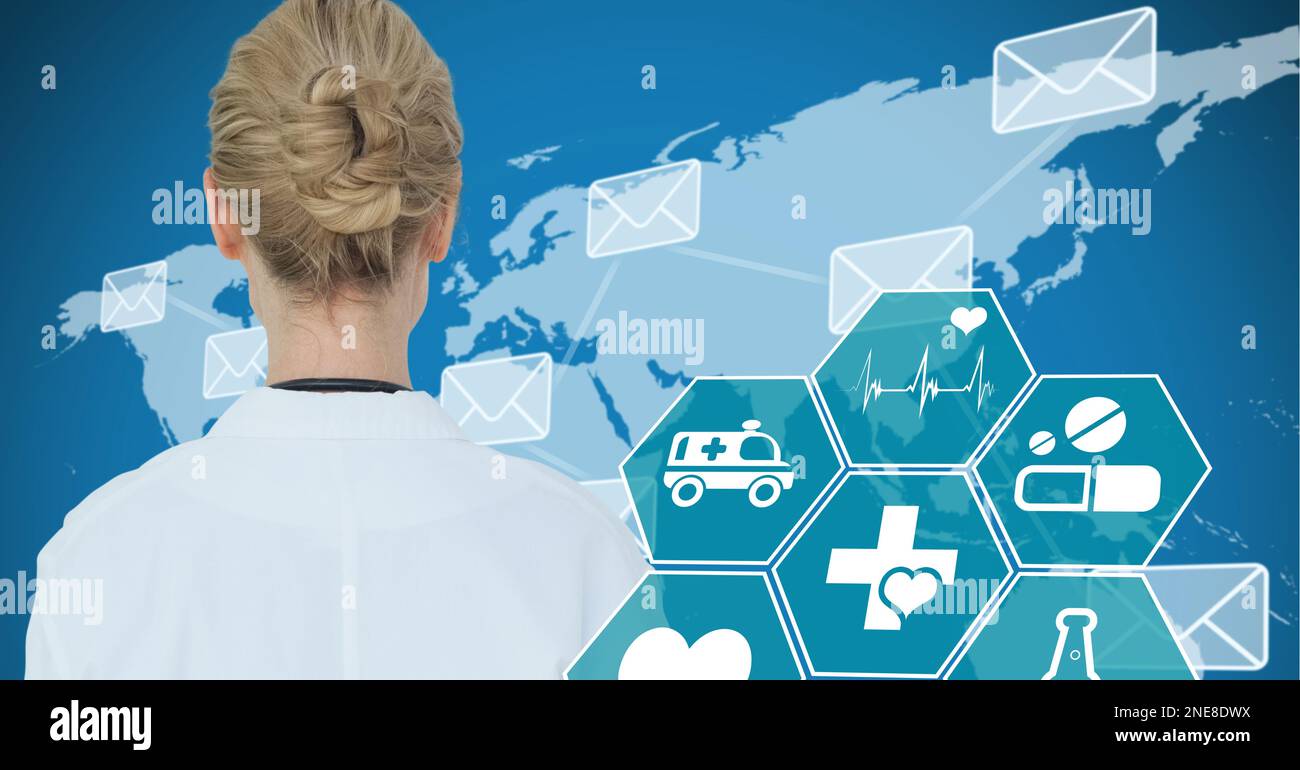 Medical icons against rear view of female doctor against world map on ...