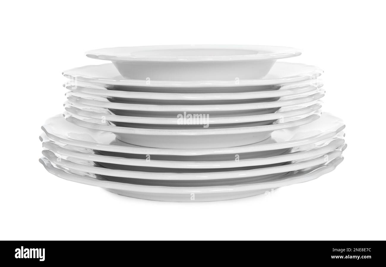 Stack of clean plates on white background Stock Photo - Alamy