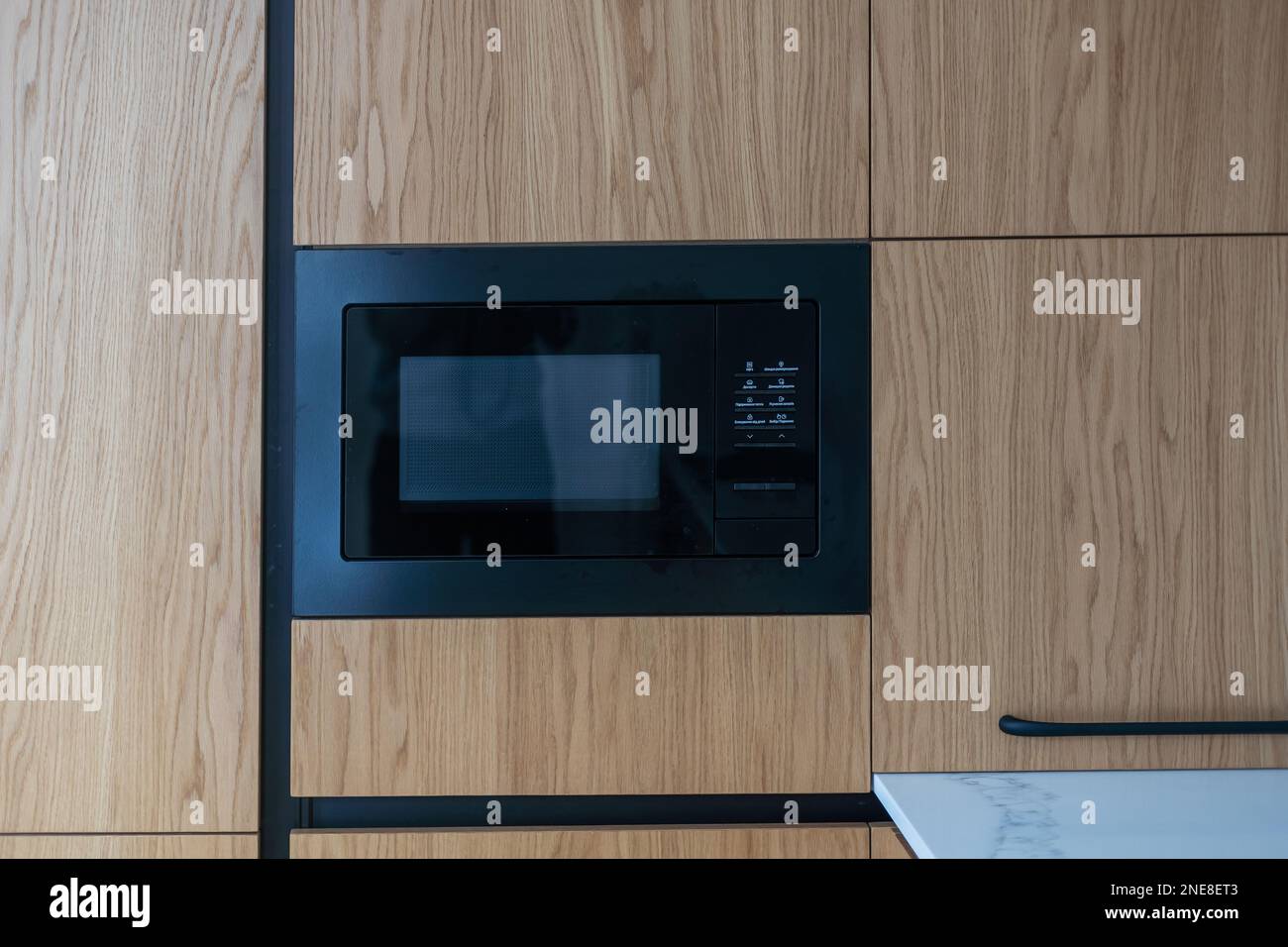 Modern built in microwave oven in the kitchen Stock Photo - Alamy