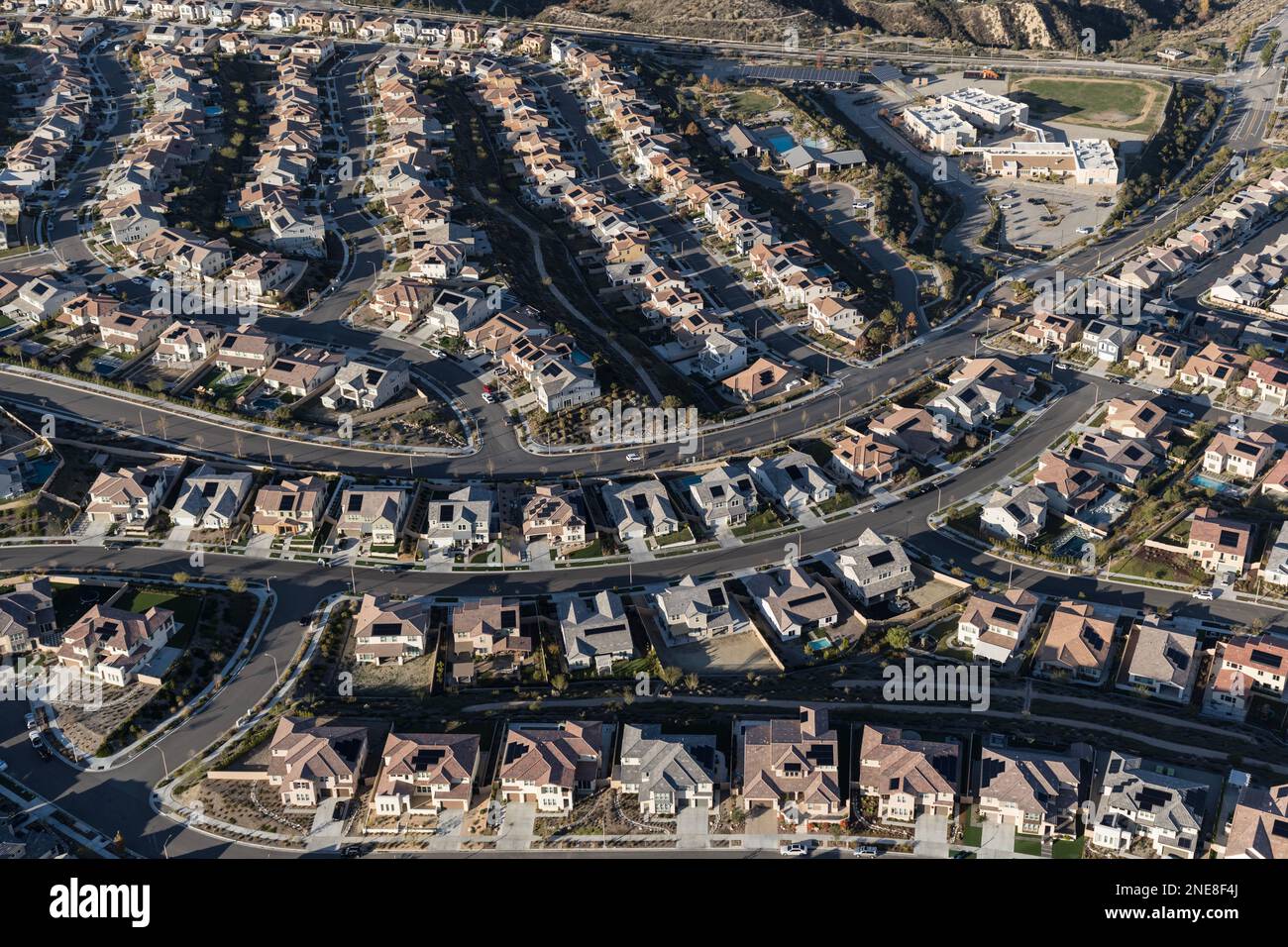 Aerial view of newly built suburban hillside sprawl in northern Los ...