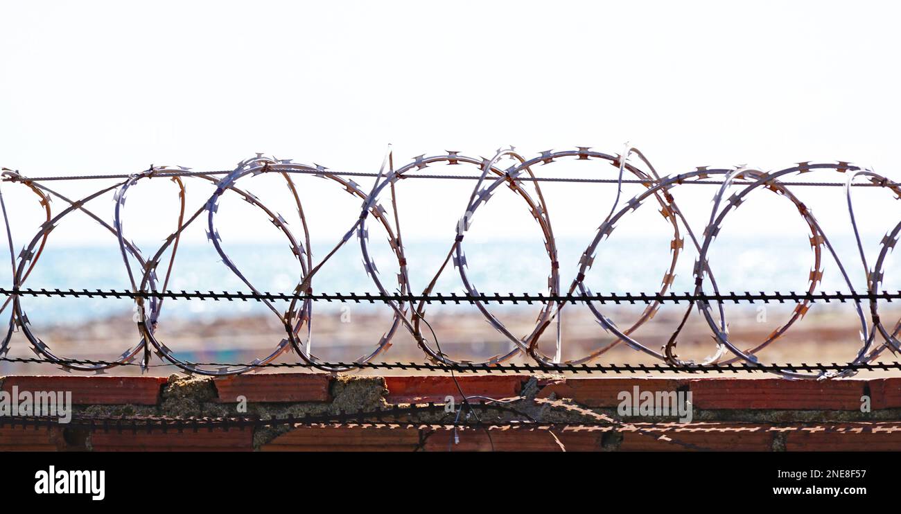 Barbed wire with concertina on a wall in Sant Adria del Besos ...