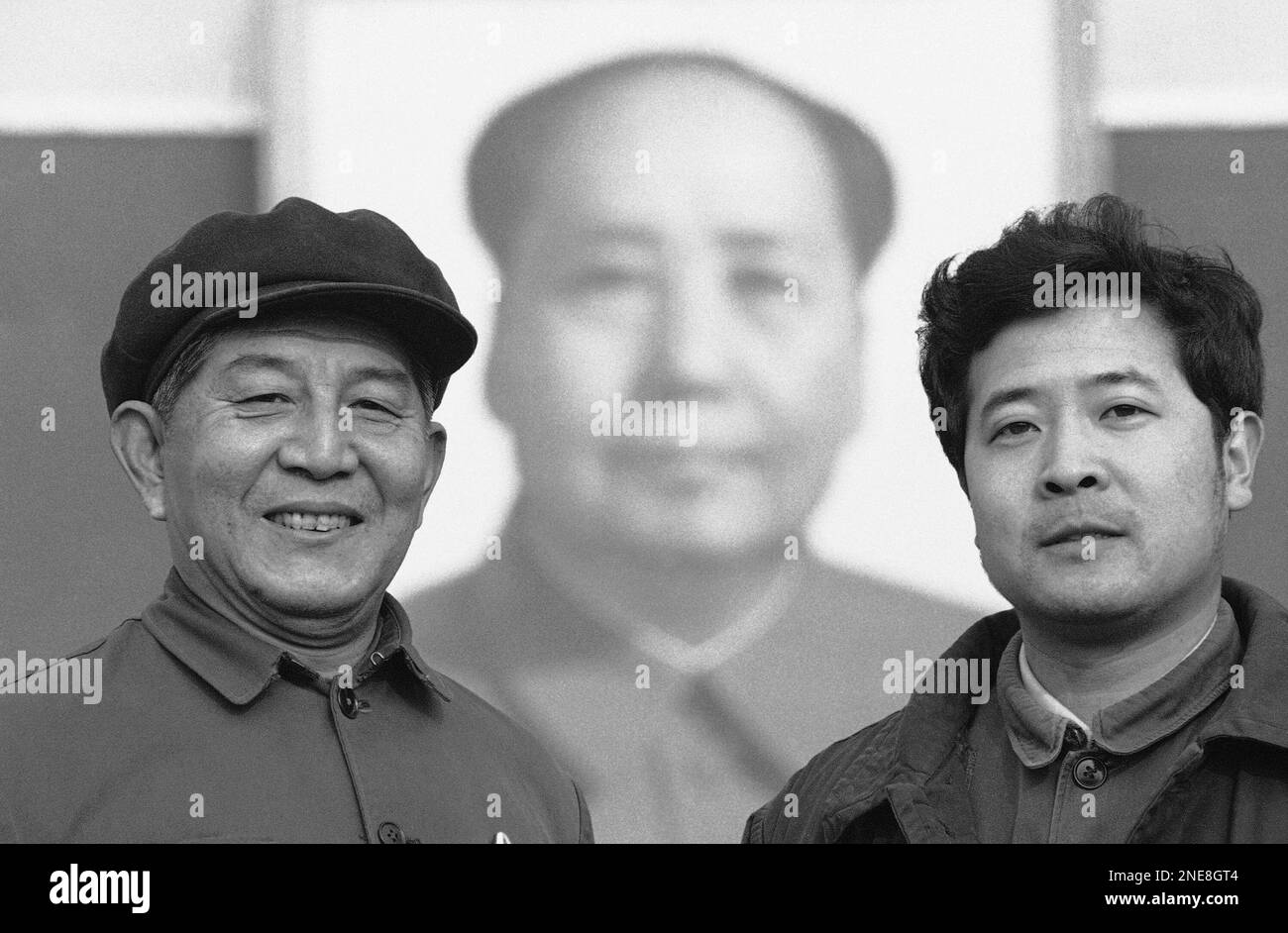 Chinese Painter Wang Guodong, left, and his protege Ge Xiaoguang pause ...