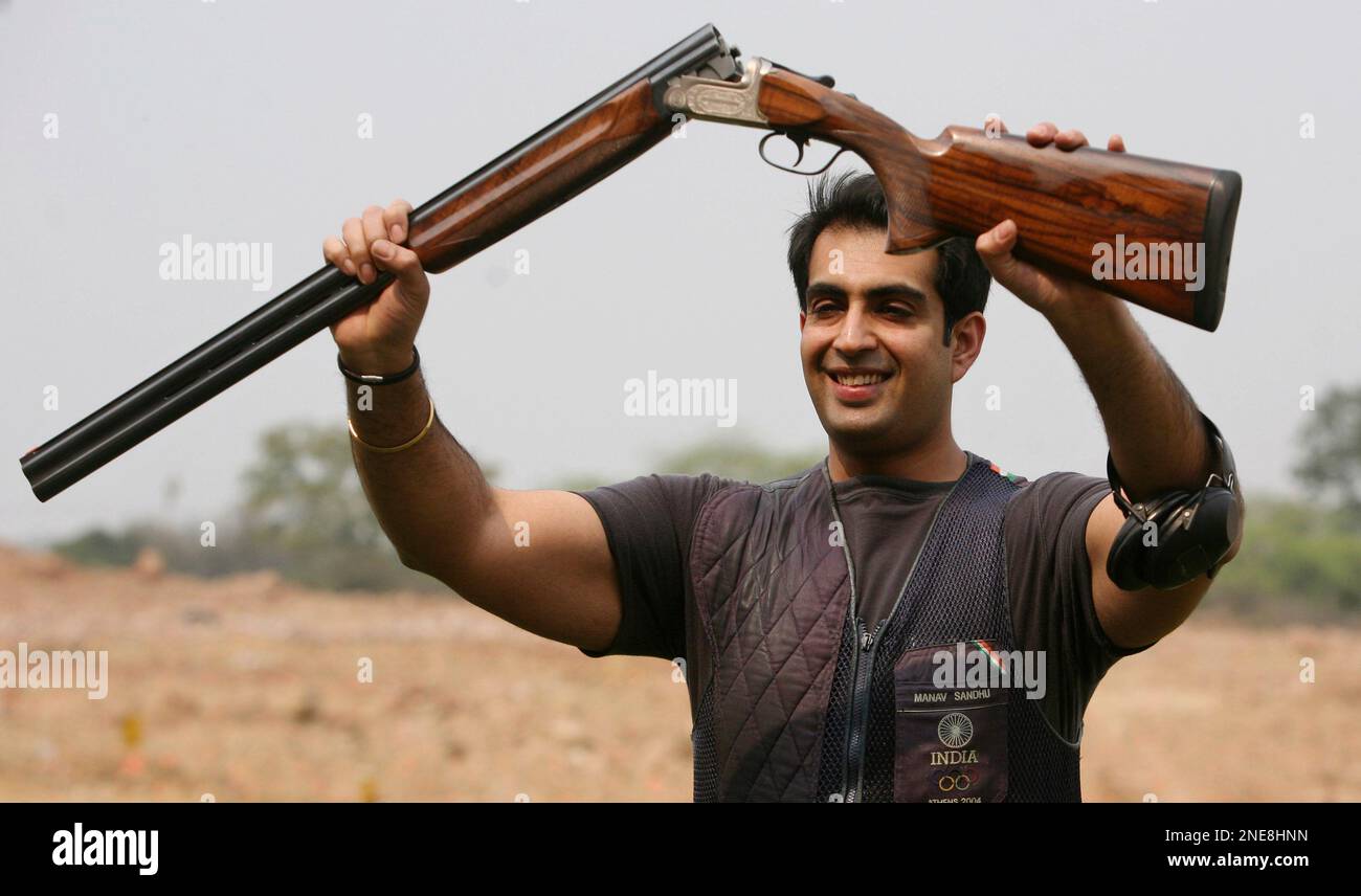 India's Manavjit Singh Sandhu poses for photographs after winning the ...