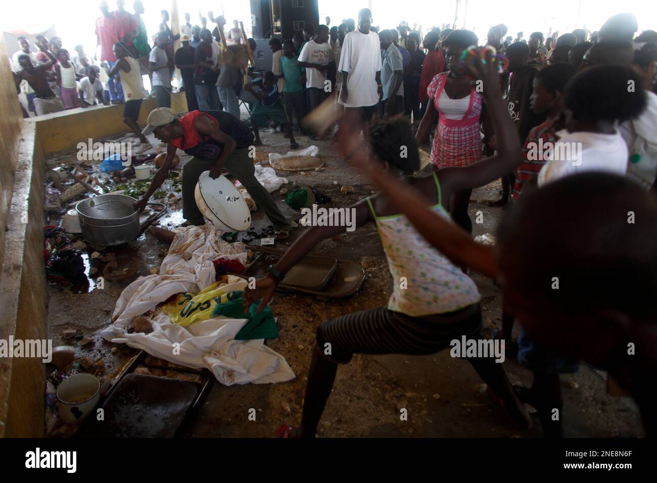 People destroy objects that were to be used in a voodoo ceremony in the ...