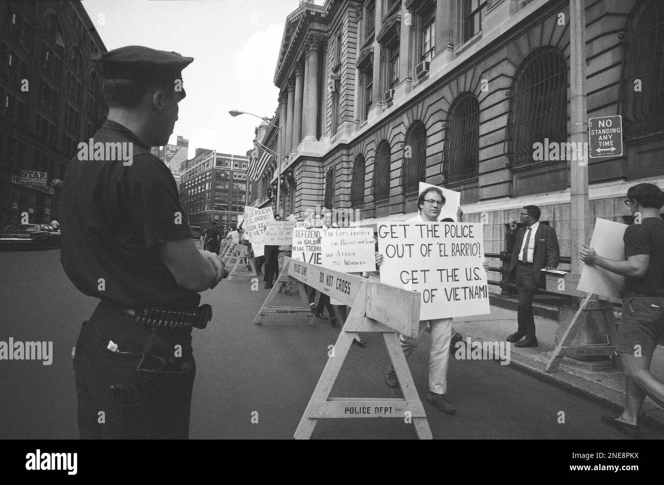 Placard carrying demonstrators march outside New York City police ...