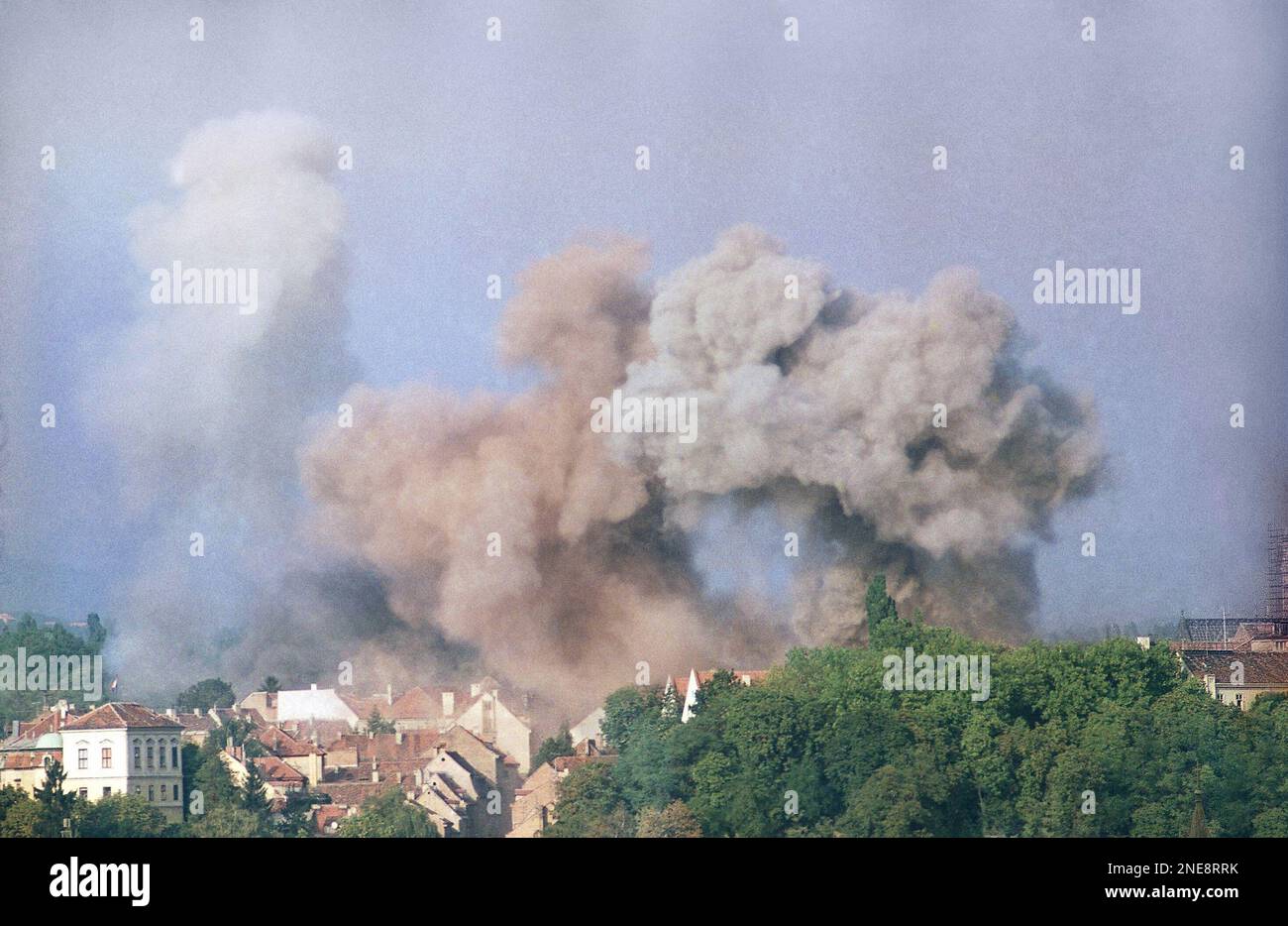 Heavy smoke rises over the office of Croatian President Franjo Tudjman ...