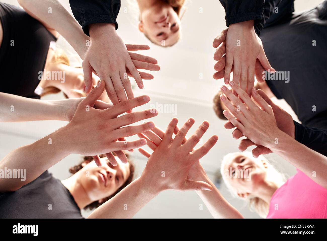 young team of multiracial athletes smiling looking at camera with ...