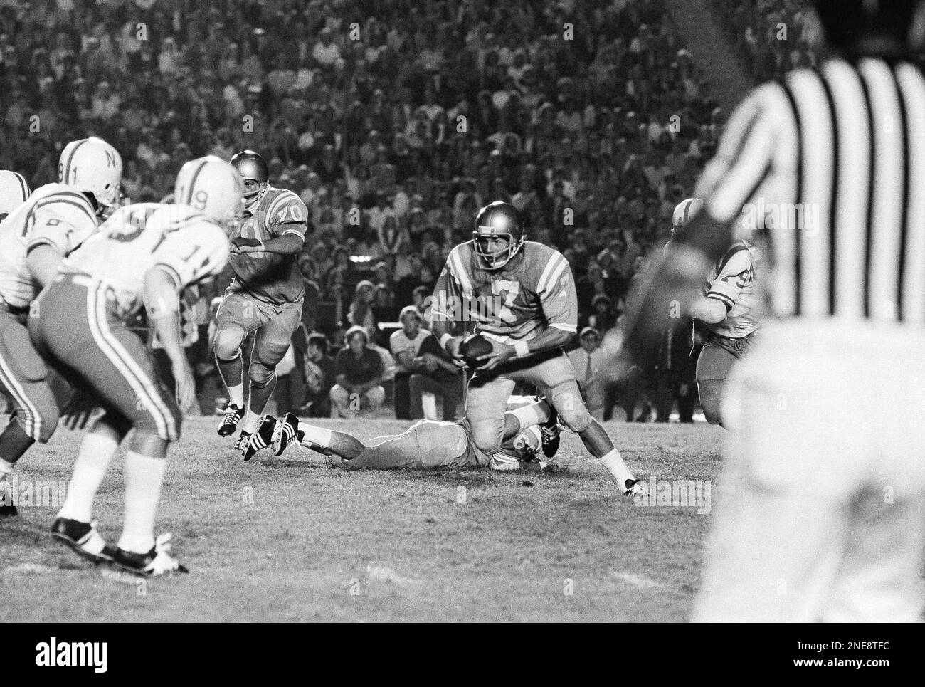 UCLA quarterback Mark Harmon eyes Nebraska defenders during Bruins? on ...