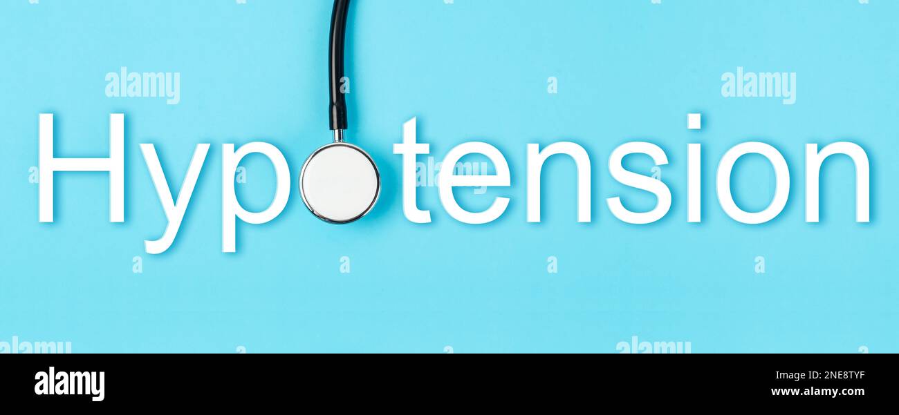 Hypotension text and medical stethoscope on blue background, Screening ...