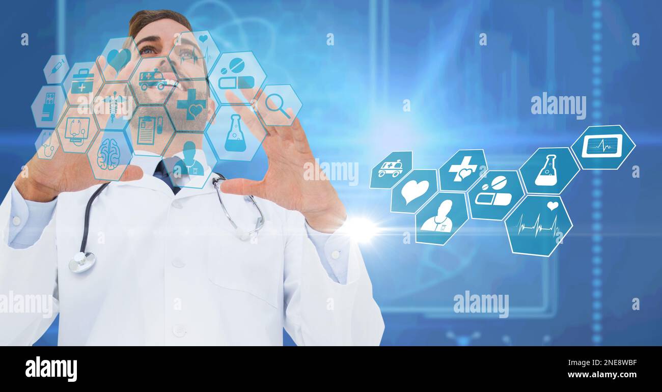 Medical icons against caucasian male doctor holding an invisible object ...