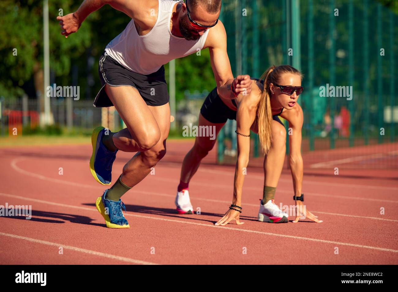 Start of the race of man and woman at the stadium, track and field ...