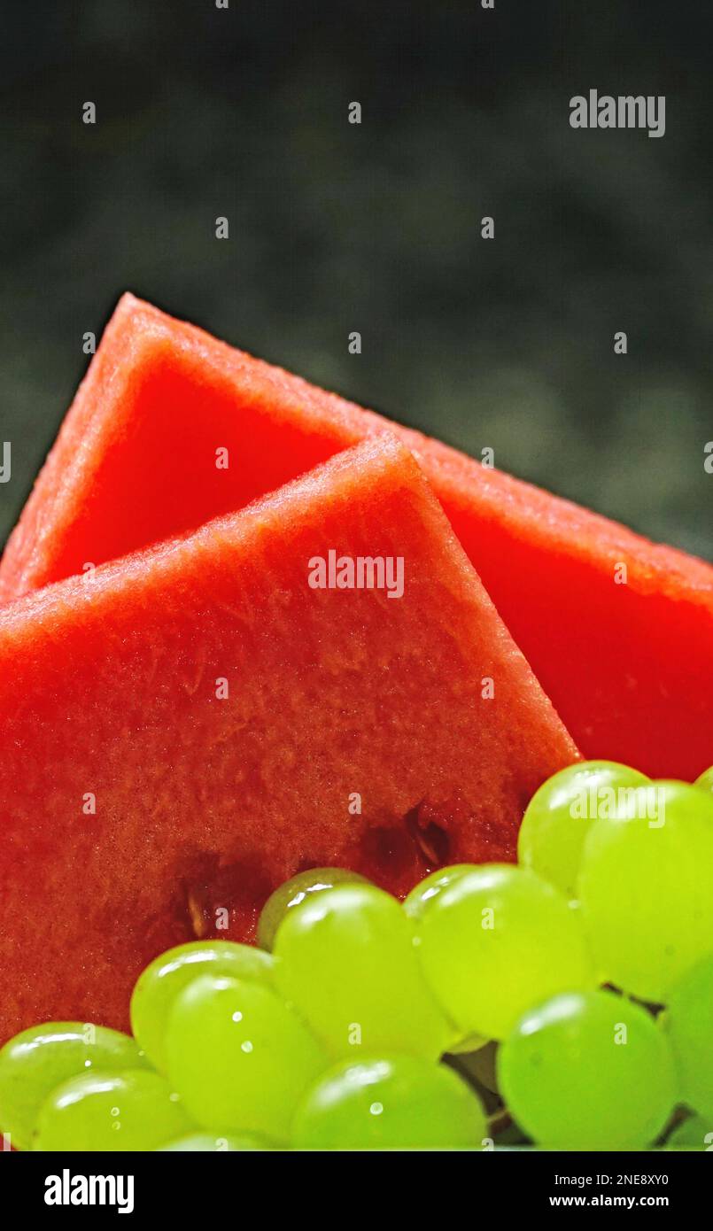 Grape and watermelon in a plastic container Stock Photo - Alamy