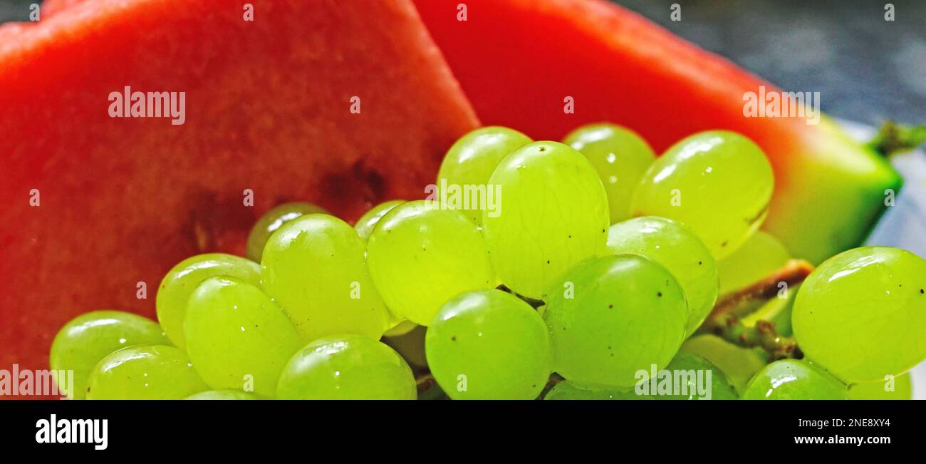 Grape and watermelon in a plastic container Stock Photo - Alamy