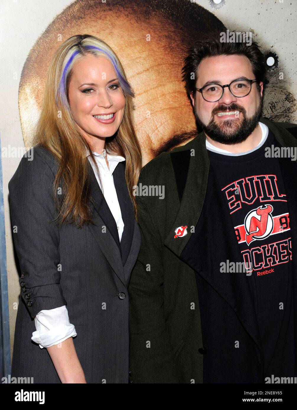 Director Kevin Smith and wife Jennifer Schwalbach attend the premiere ...