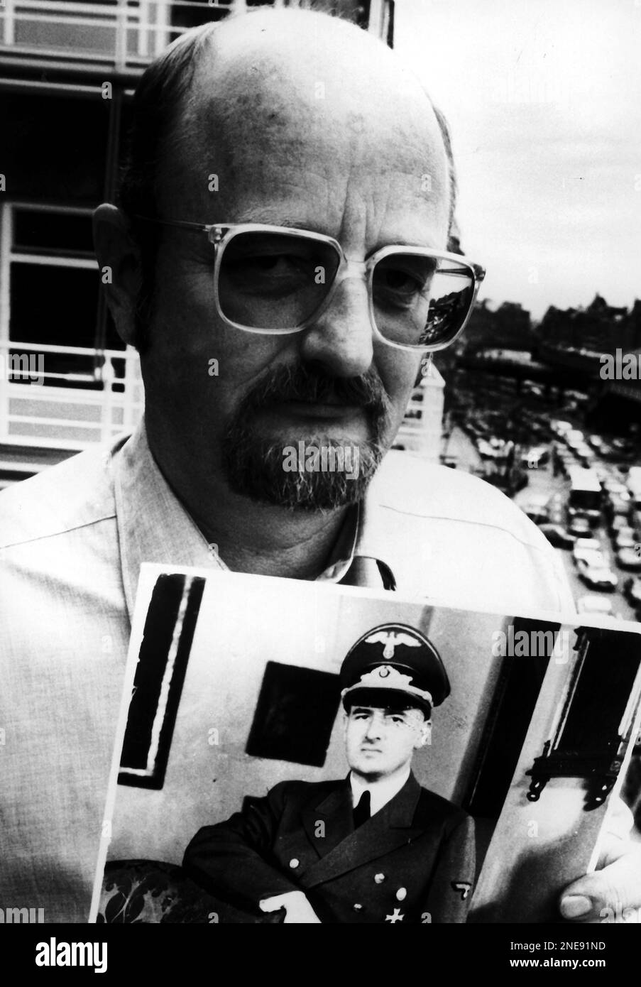 Niklas Frank holds up a photograph in 1991 in Hamburg, Germany of his ...