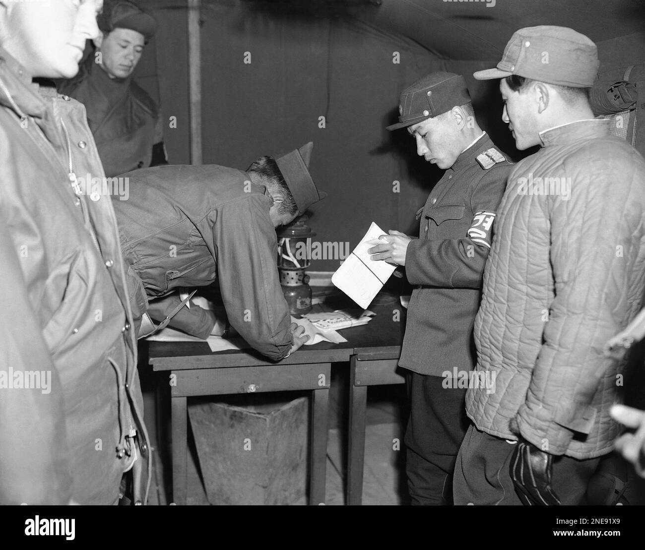 Army postal officer, Lt. Harold T. Bratchell (left) of Washington, D.C ...
