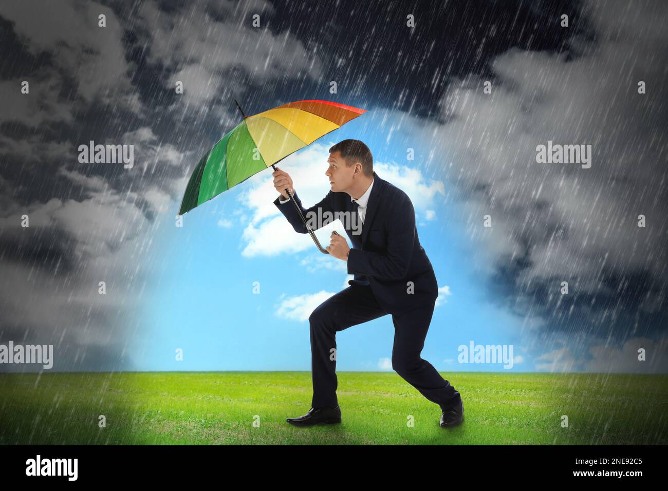 Man heavy rain hiding hi-res stock photography and images - Alamy