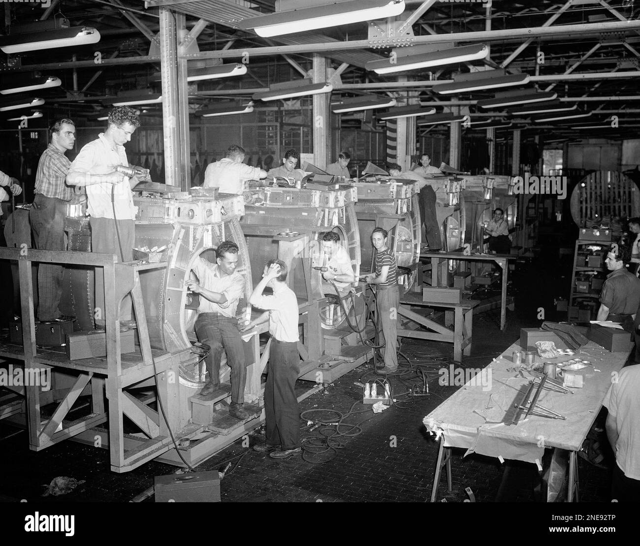 Lined up in a row for speedier completion are these rear sections of ...