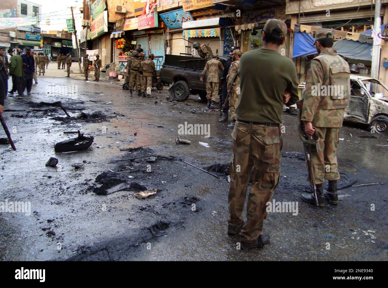Pakistan army soldiers cordon off the site after a blast apparently ...