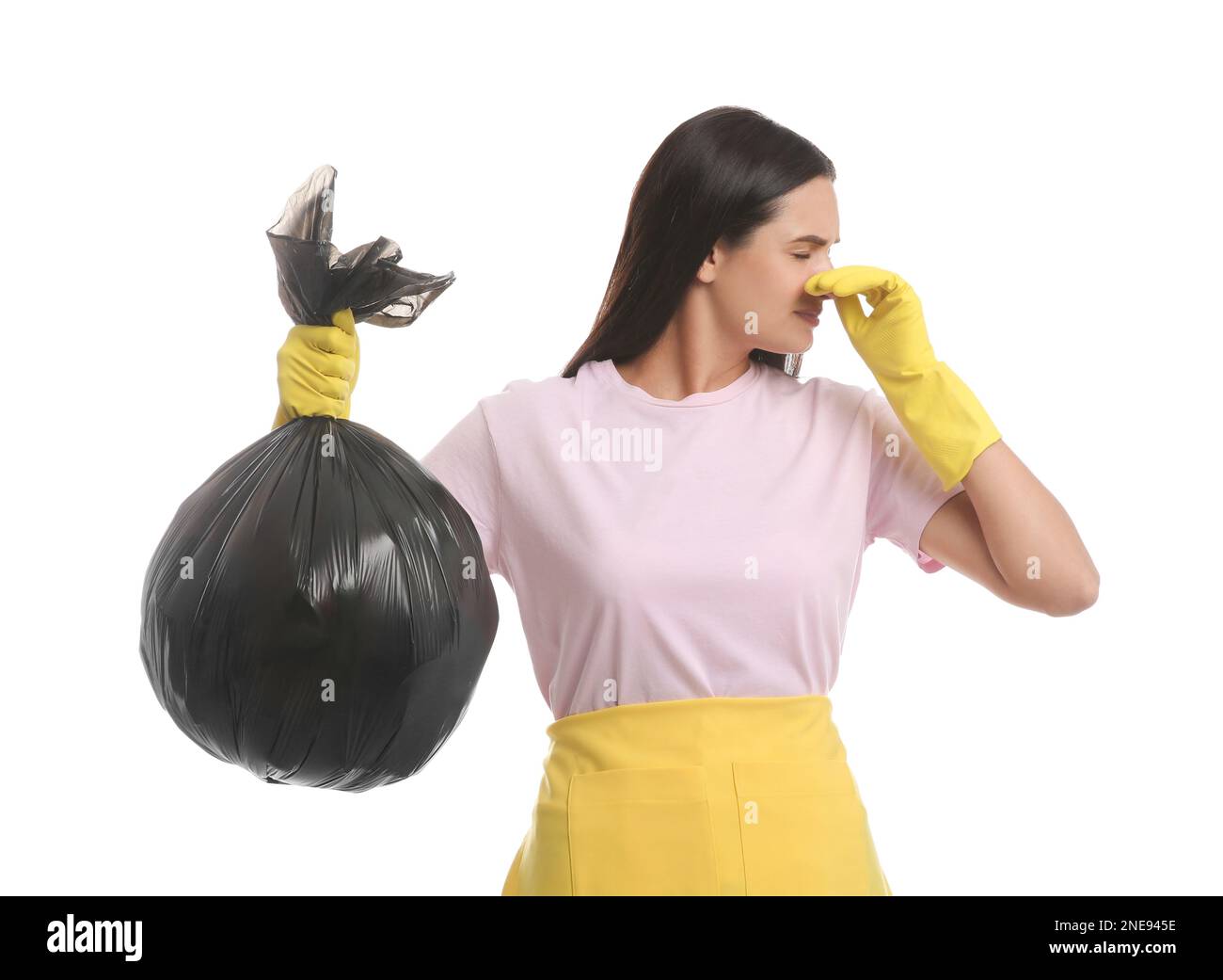 Woman holding full garbage bag on white background Stock Photo - Alamy