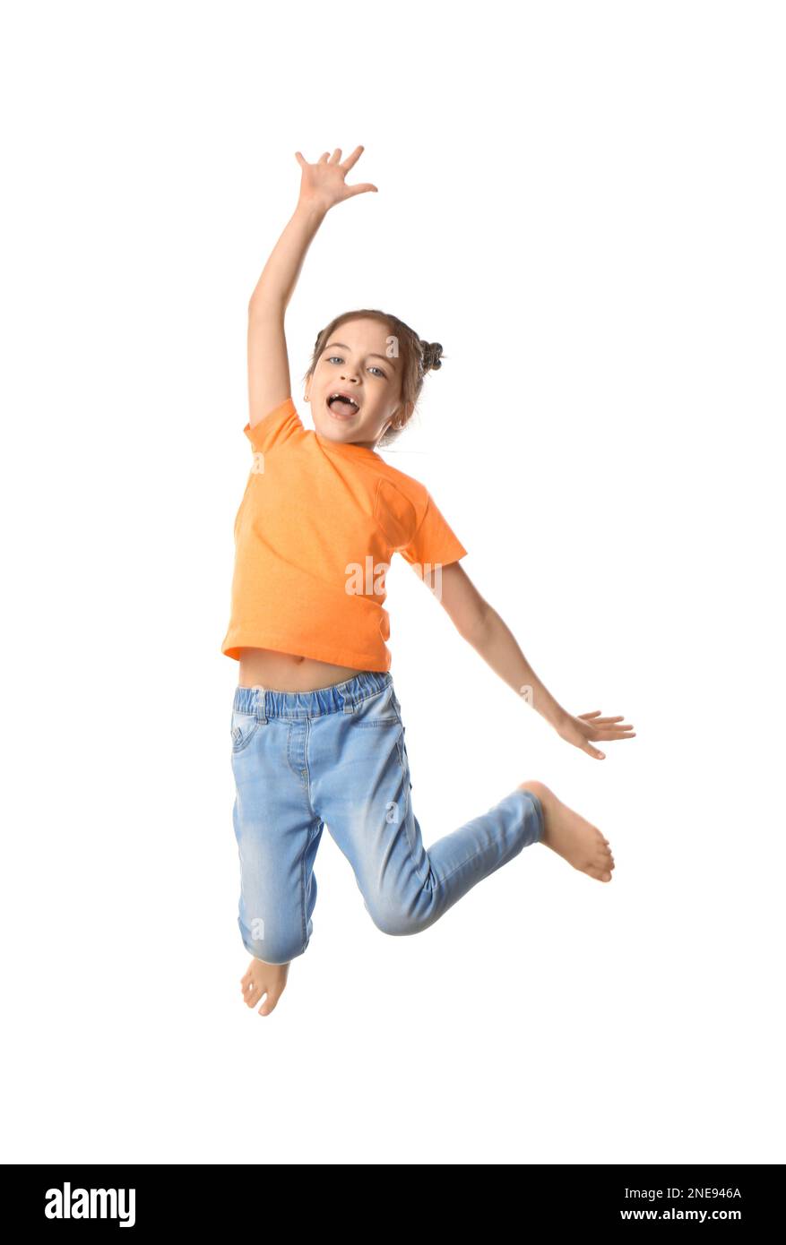 Cute little girl jumping on white background Stock Photo - Alamy
