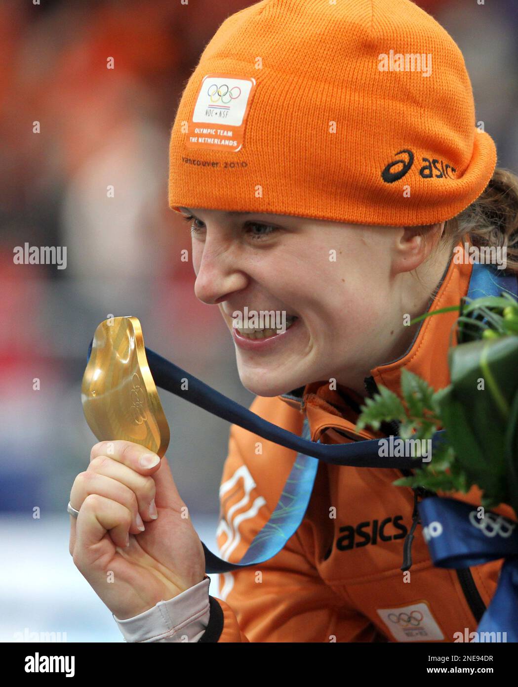 Gold medallist Netherlands's Ireen Wust reacts holding her gold medal ...