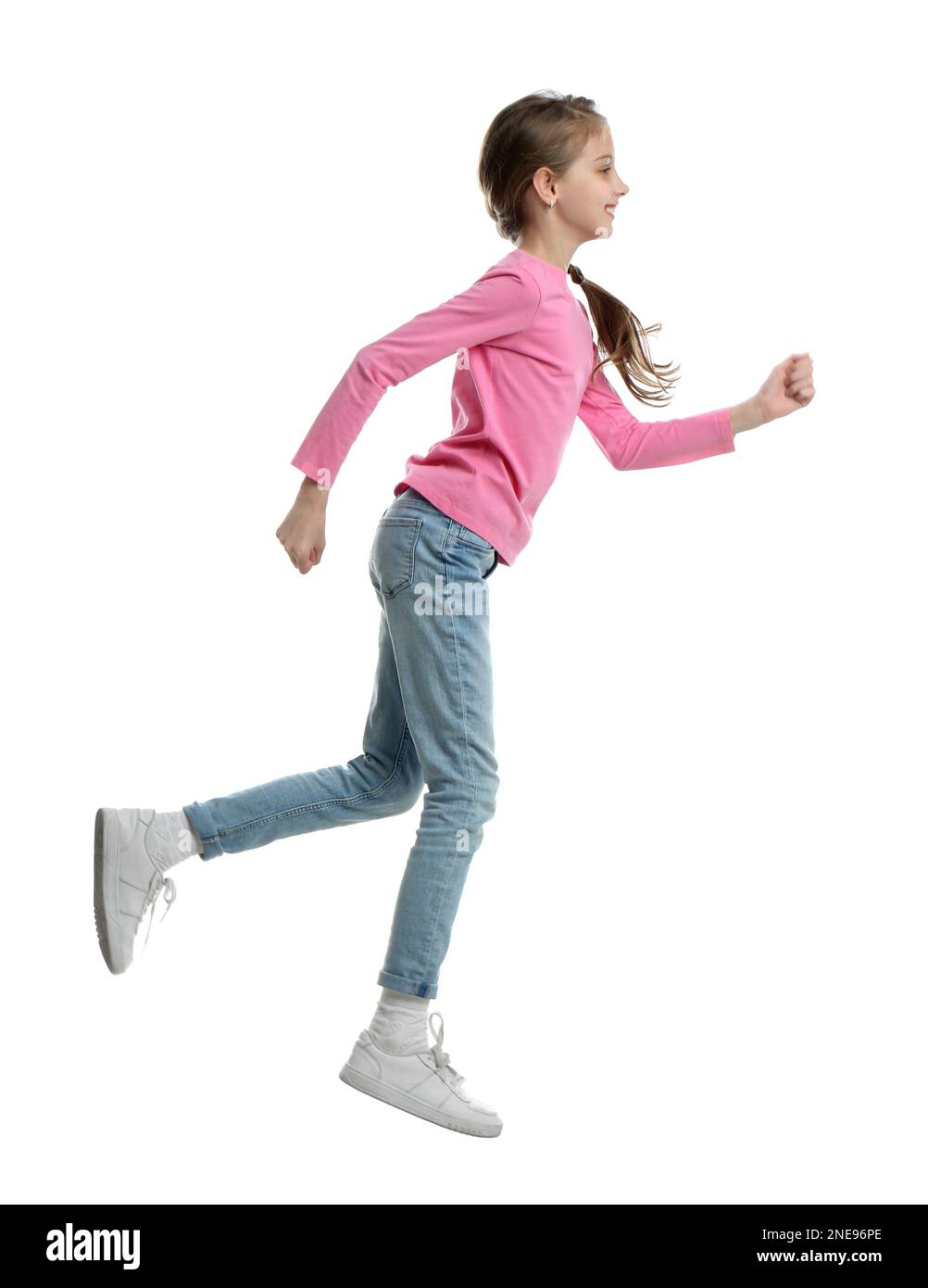 Cute little girl running on white background Stock Photo - Alamy