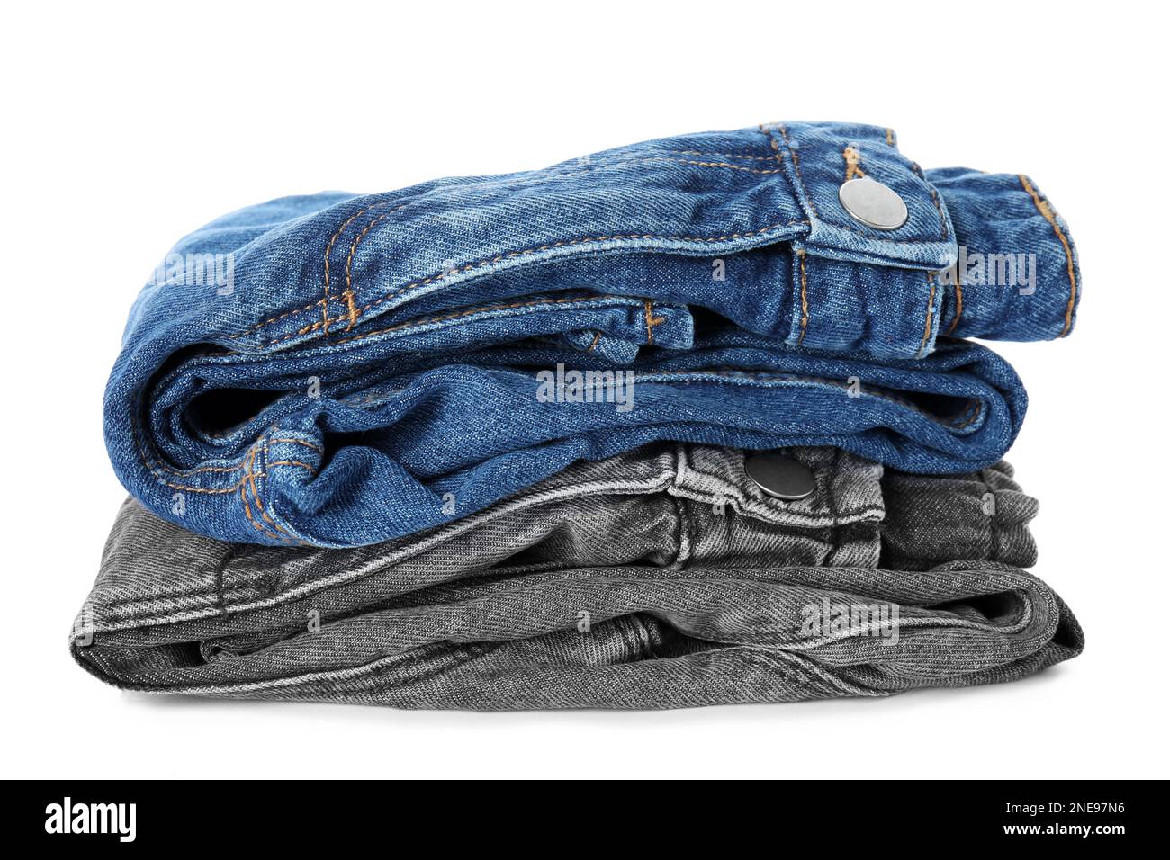 Stack of folded jeans on white background Stock Photo - Alamy