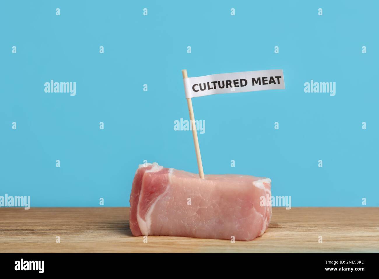 Sample of lab grown pork labeled Cultured Meat on wooden table Stock ...