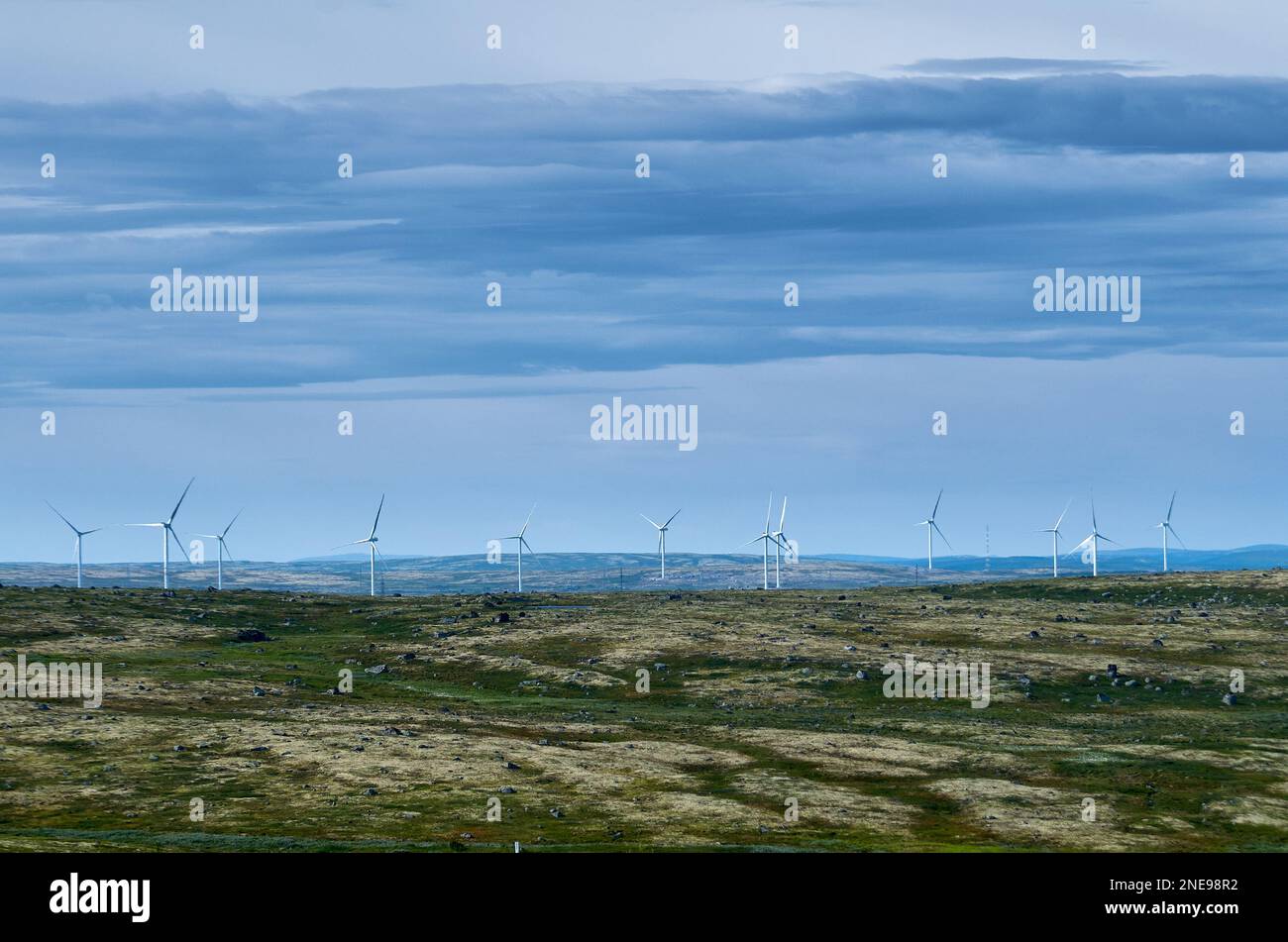 Wind farm in hilly area under cloudy sky Stock Photo - Alamy