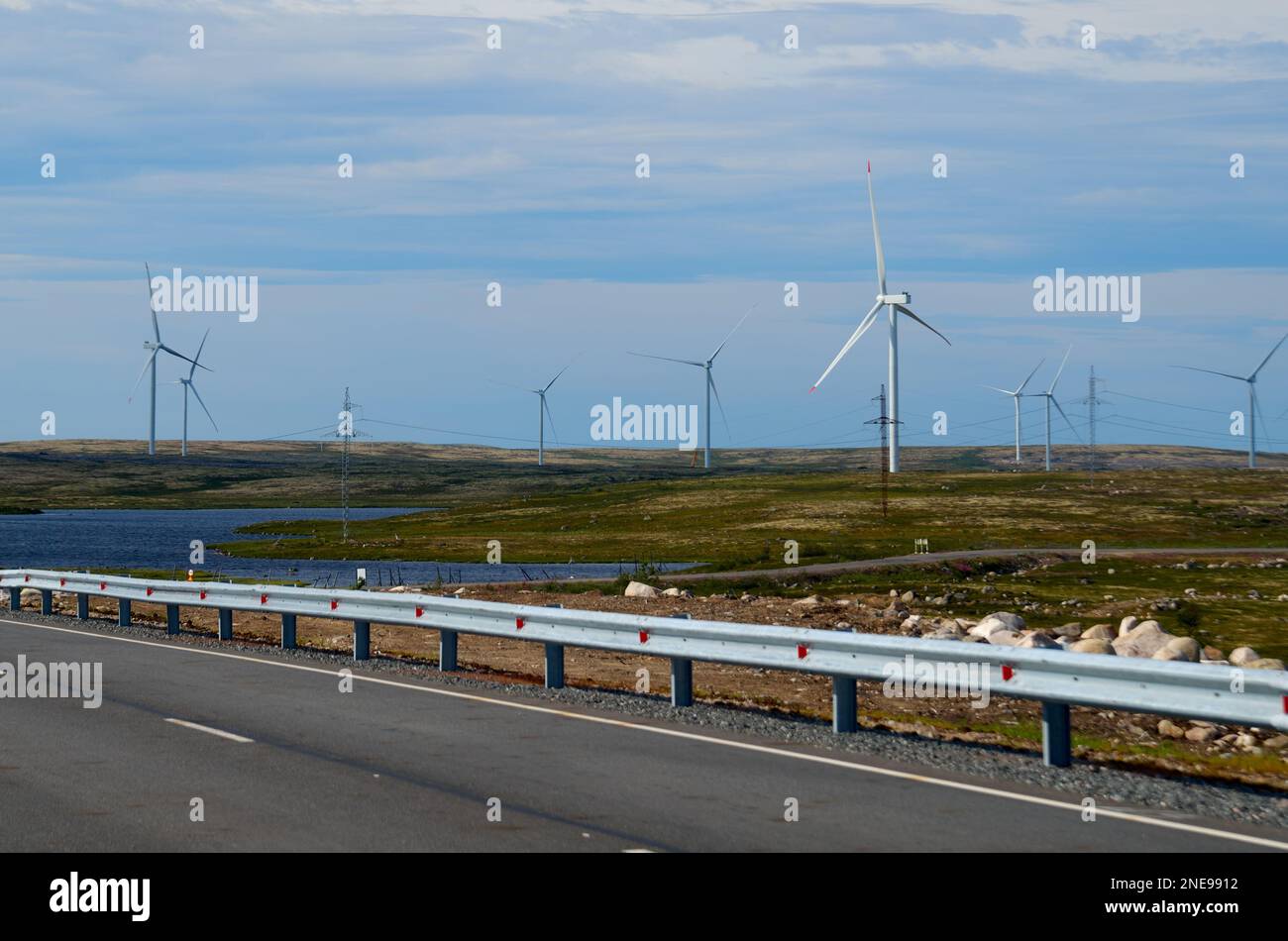 Wind farm in hilly area under cloudy sky Stock Photo - Alamy
