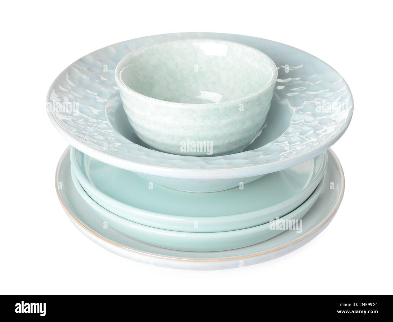 Stack of clean dishes on white background Stock Photo - Alamy