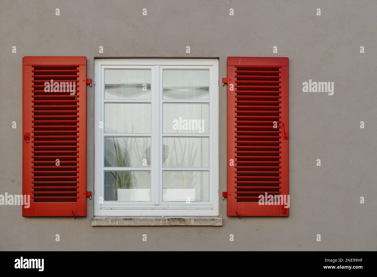 Italian windows on the grey wall facade with open red color classic ...