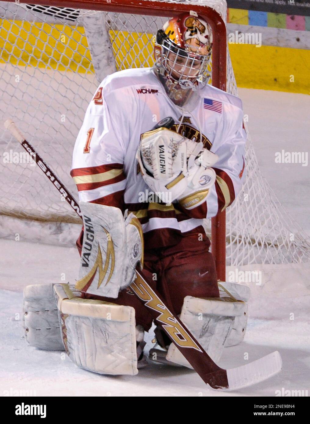 Denver goaltender Marc Cheverie makes a save against Michigan Tech ...