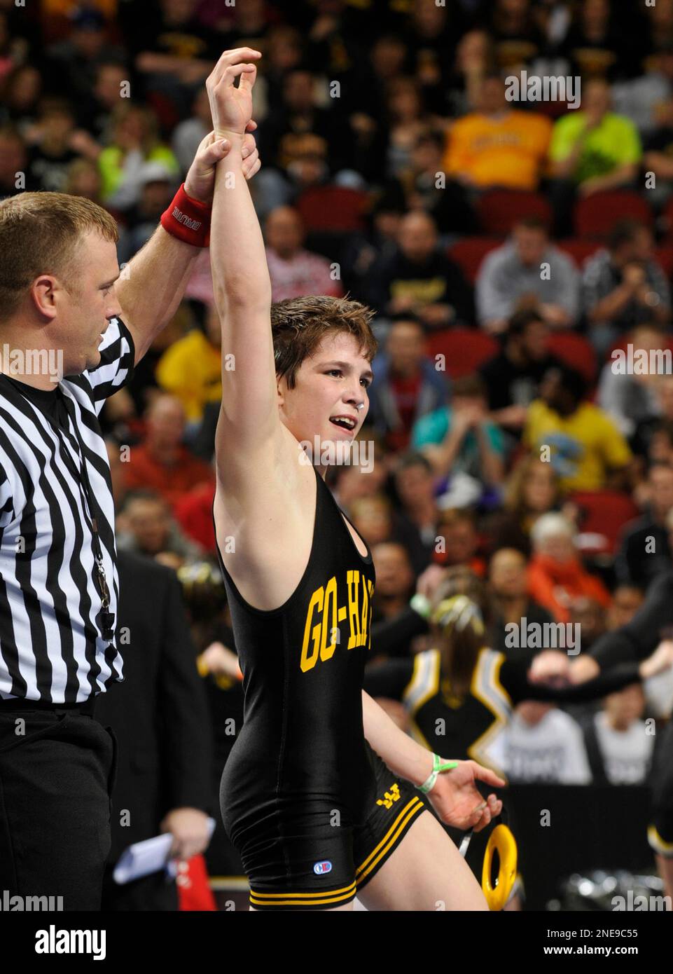 Waverly Shell-Rock's Eric DeVos has his arm raised as the champion ...