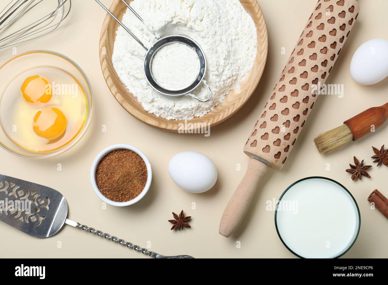 Cooking utensils and ingredients on beige background, flat lay Stock ...