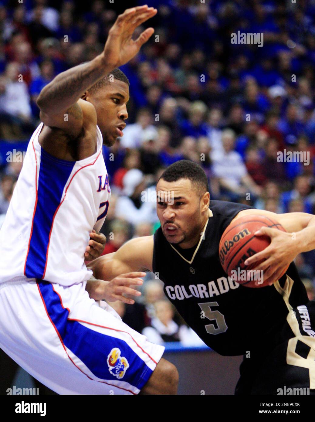 Colorado forward Marcus Relphorde (5) is covered by Kansas forward ...