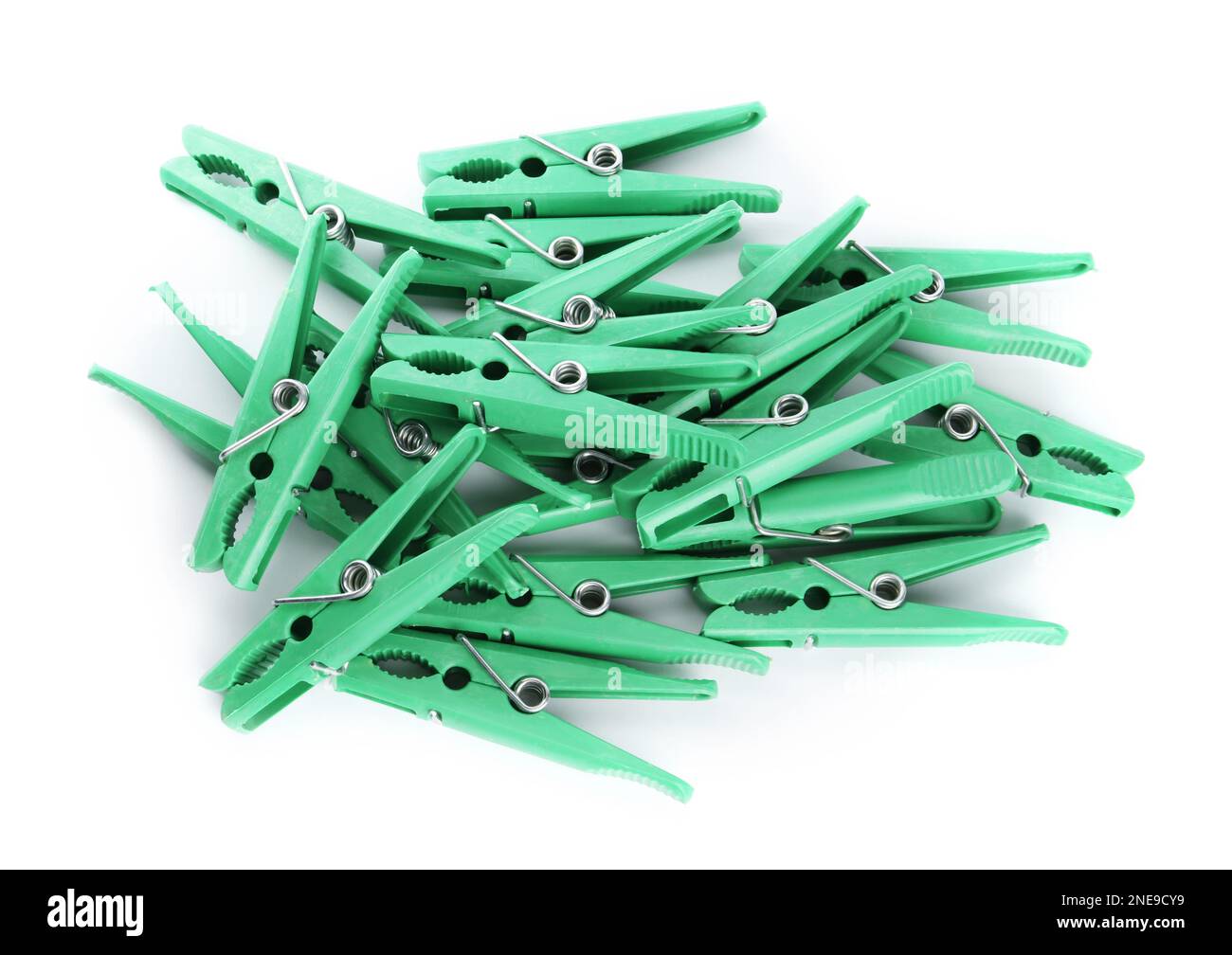 Green plastic clothespins on white background, top view Stock Photo - Alamy