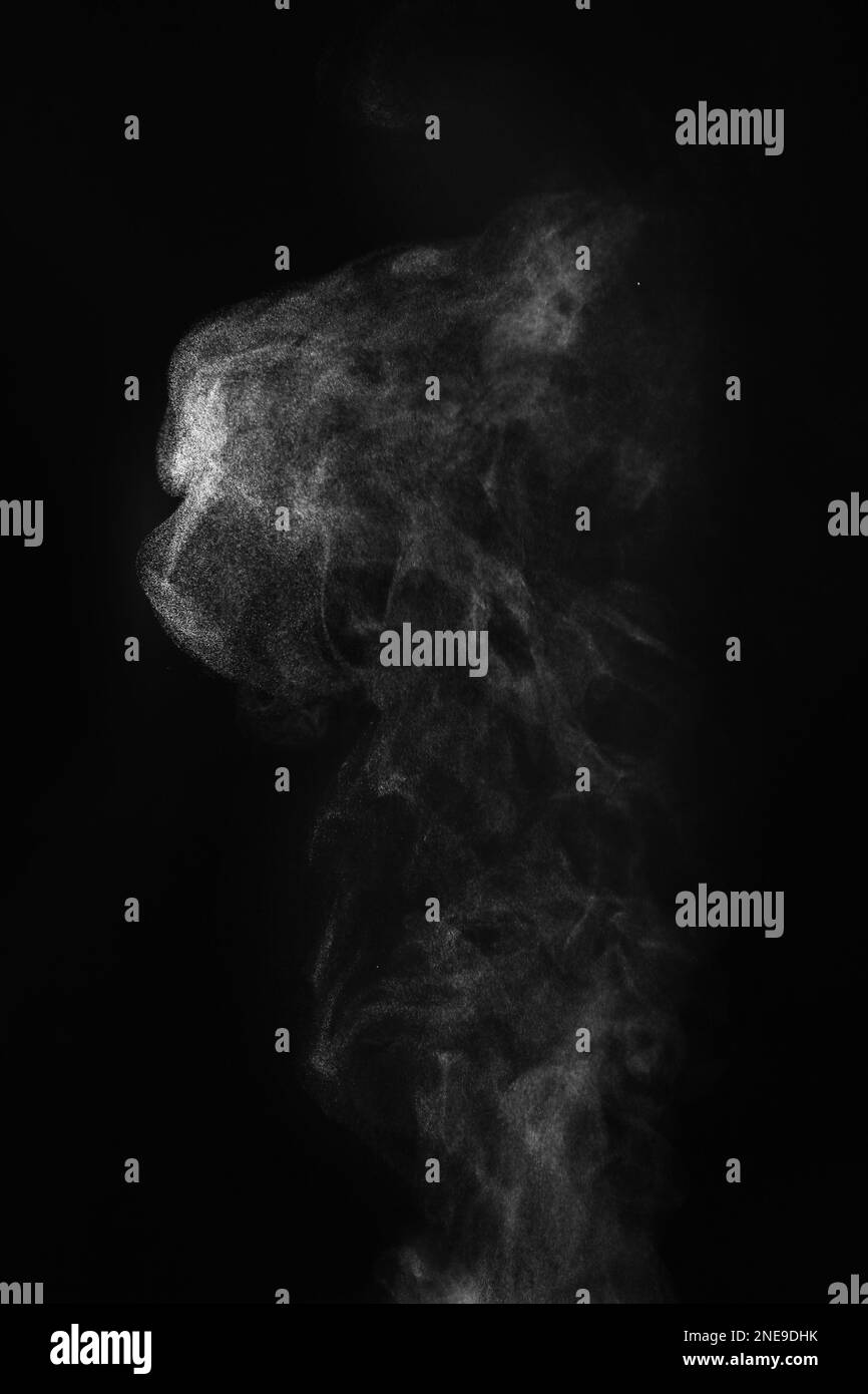 White steam column rising on black background Stock Photo - Alamy