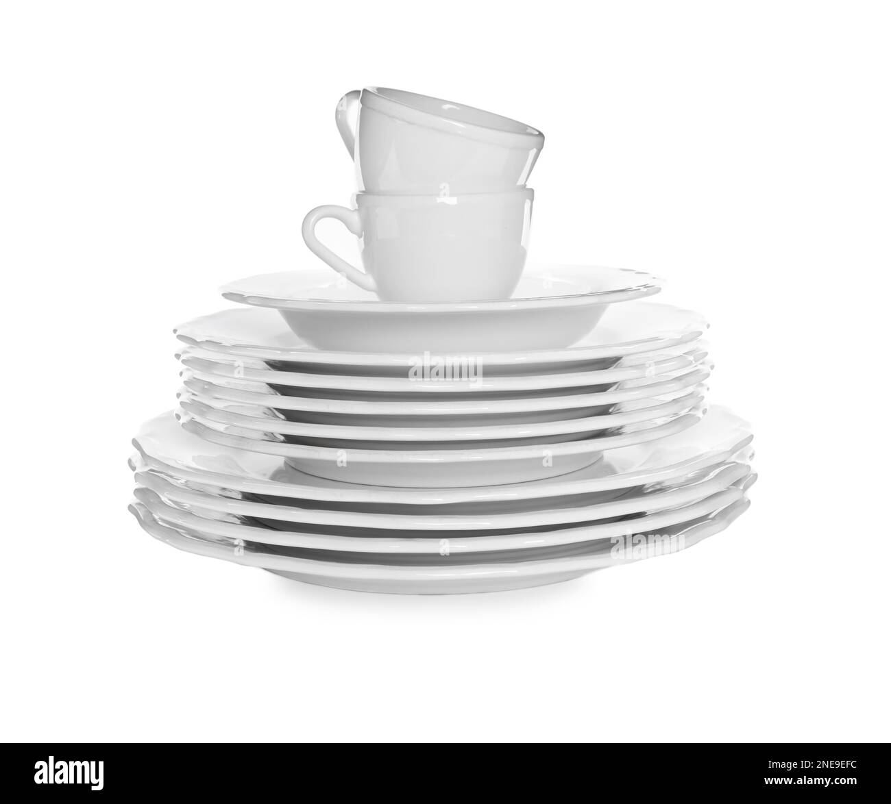 Stacked plates and cups on white background Stock Photo - Alamy