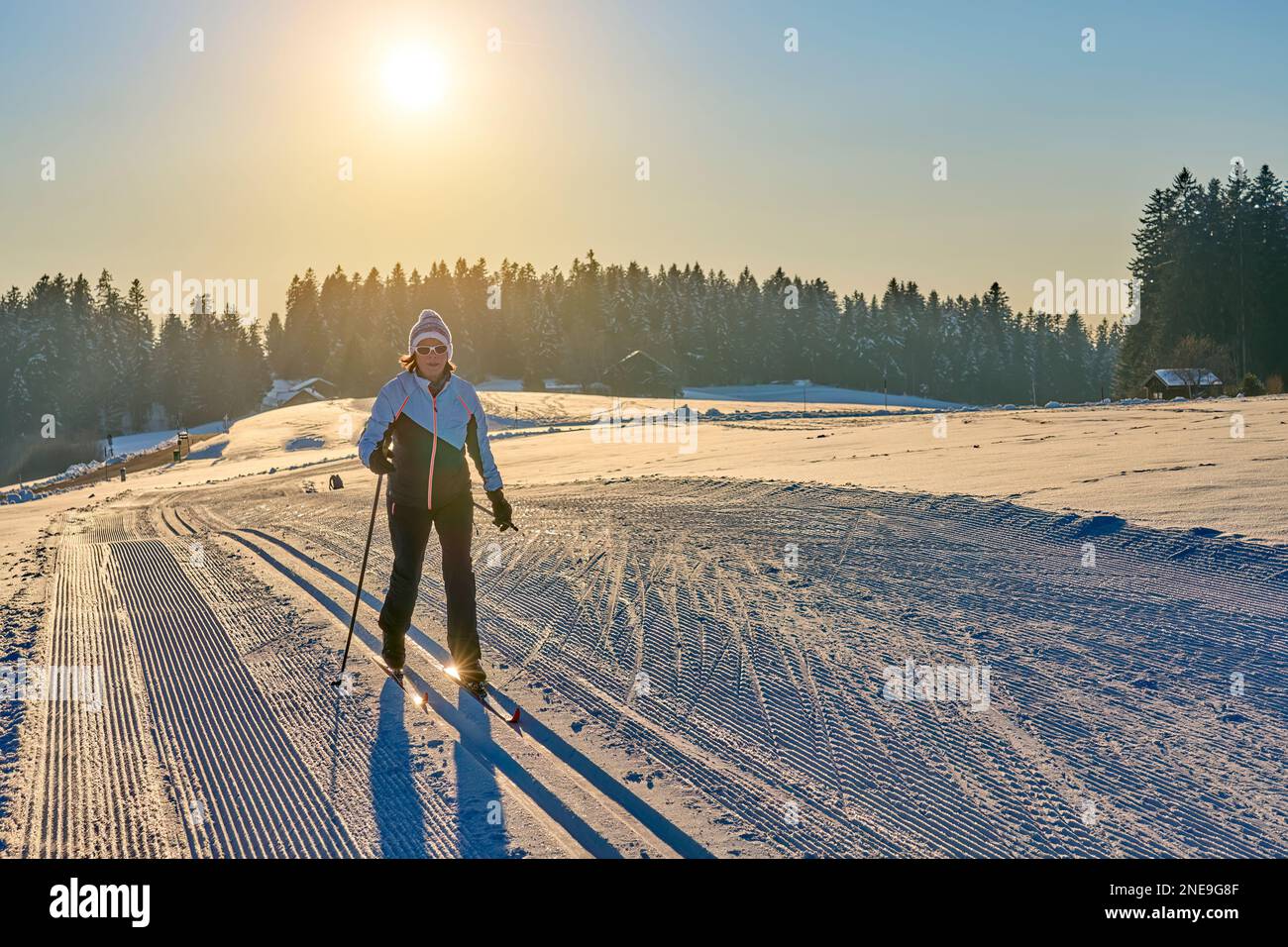 nice, active woman cross country skiing in the Bregenz Forest Mountains ...